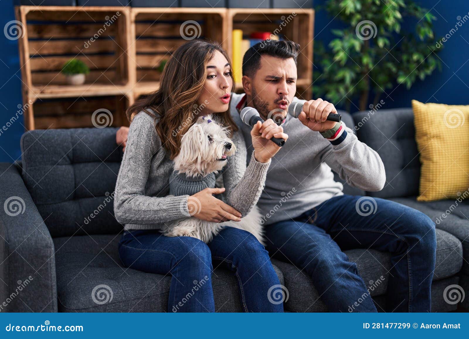 Man and Woman Singing Song Sitting on Sofa with Dog at Home Stock Image ... Man and Woman Singing Song Sitting on Sofa with Dog at Home Stock Image ...
