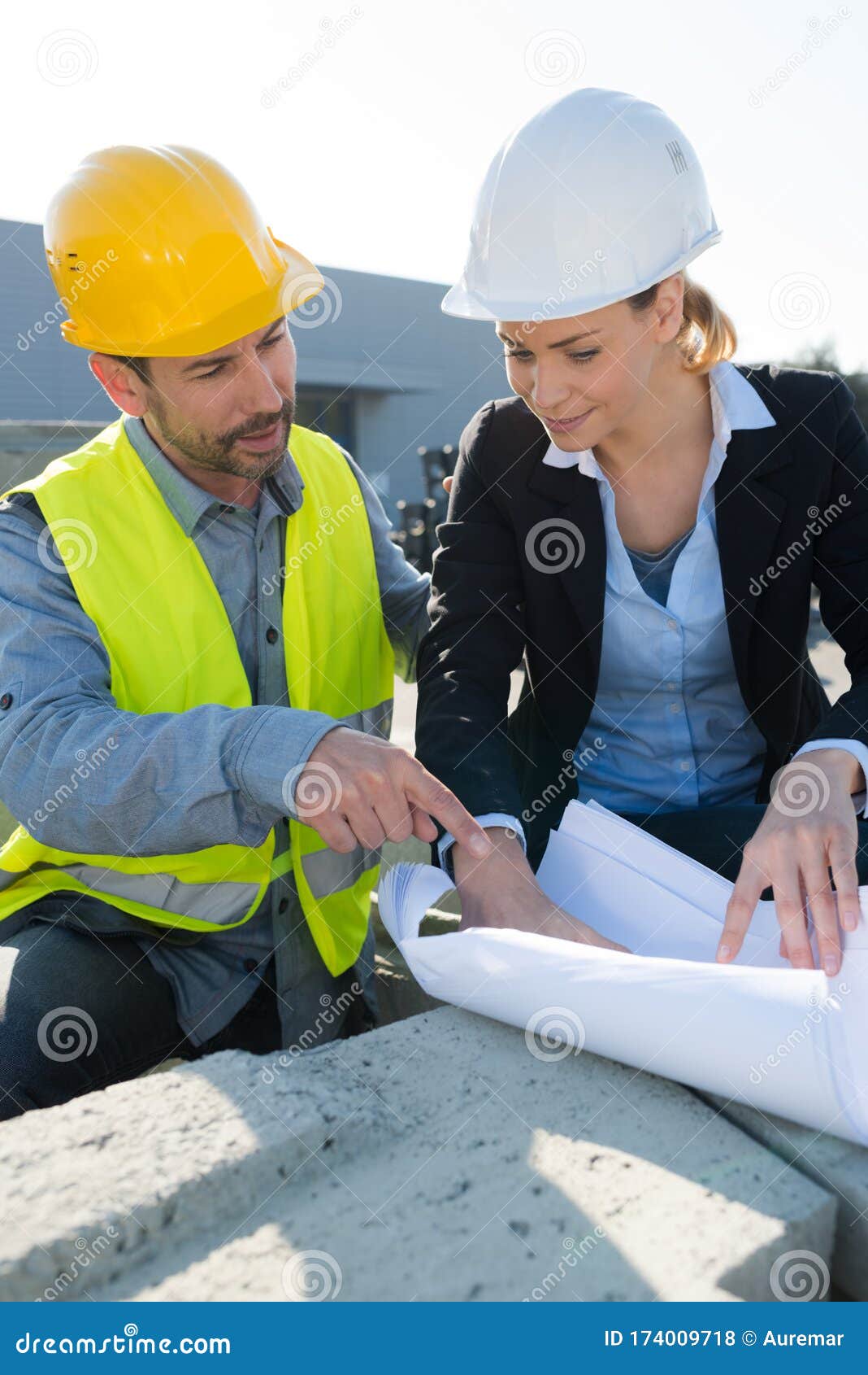 Man and Woman on Site Looking at Plans Stock Photo - Image of project ...