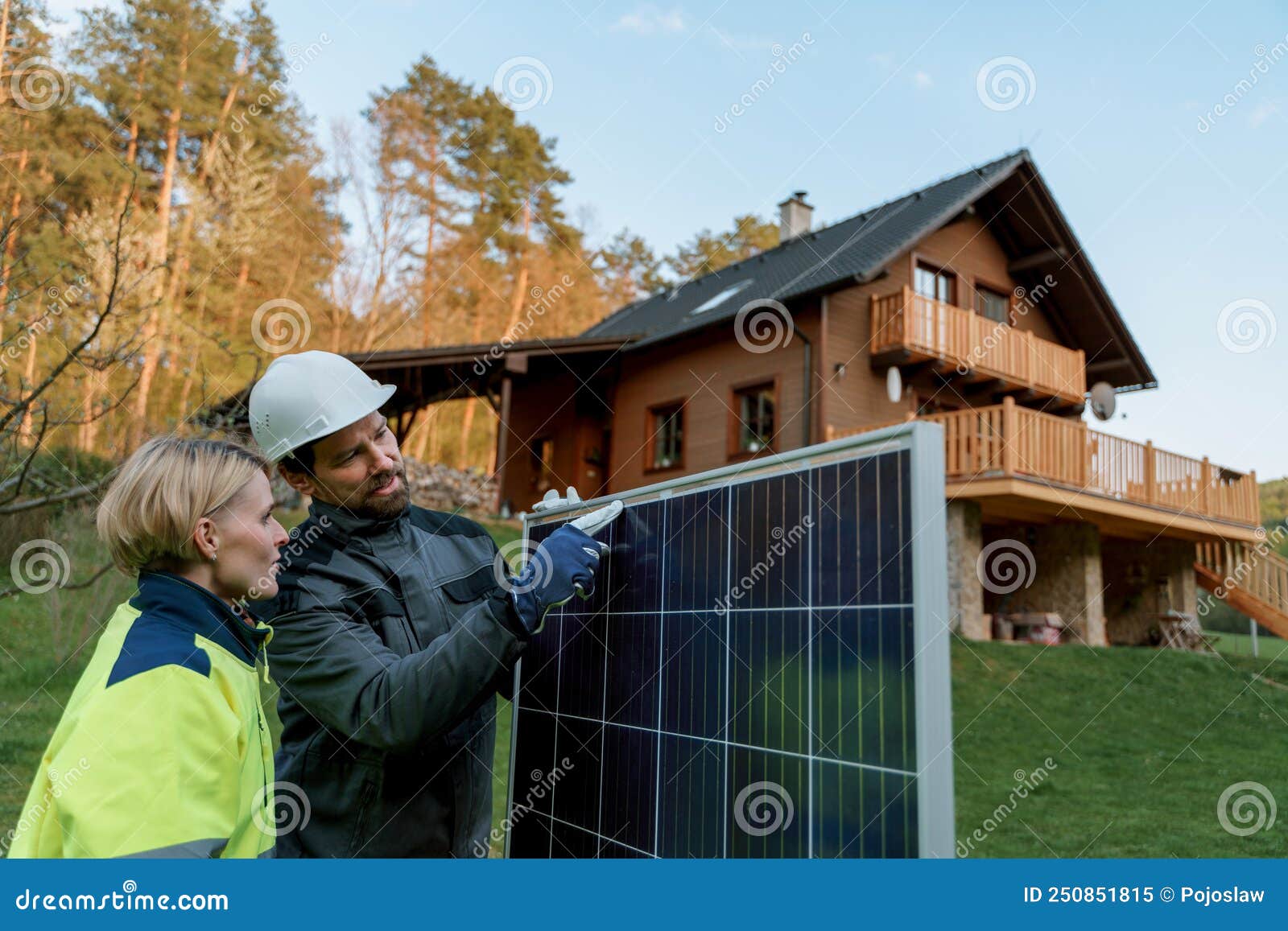 Man and Woman Solar Installers Carrying Solar Module while Installing ...