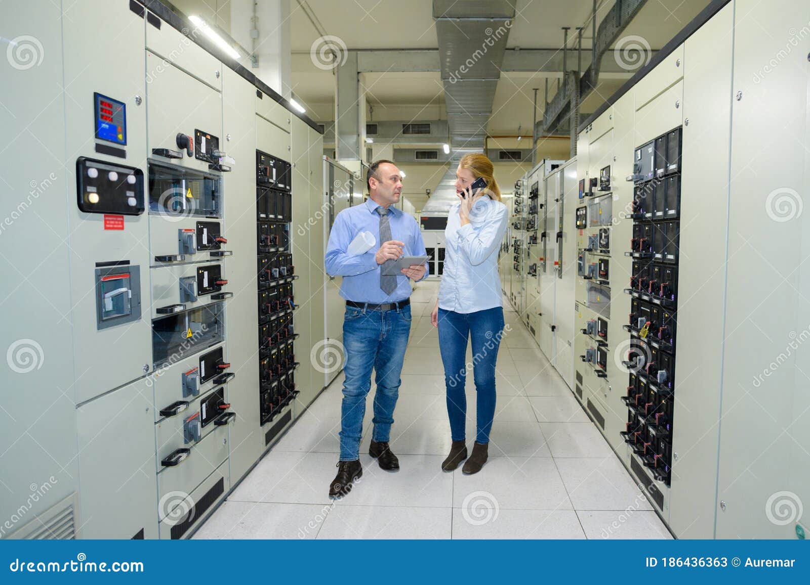 Man and Woman Standing by Server Room Stock Image - Image of management ...