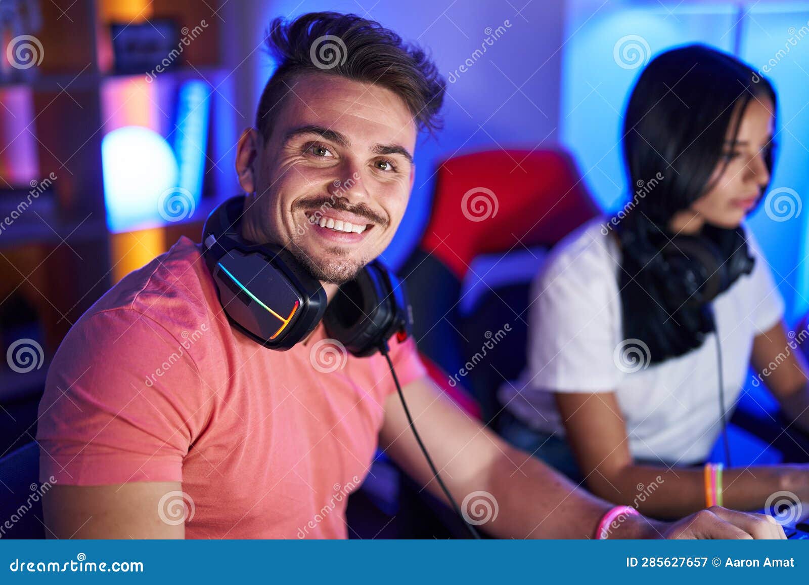 Man and Woman Streamers Playing Video Game Using Computer at Gaming ...