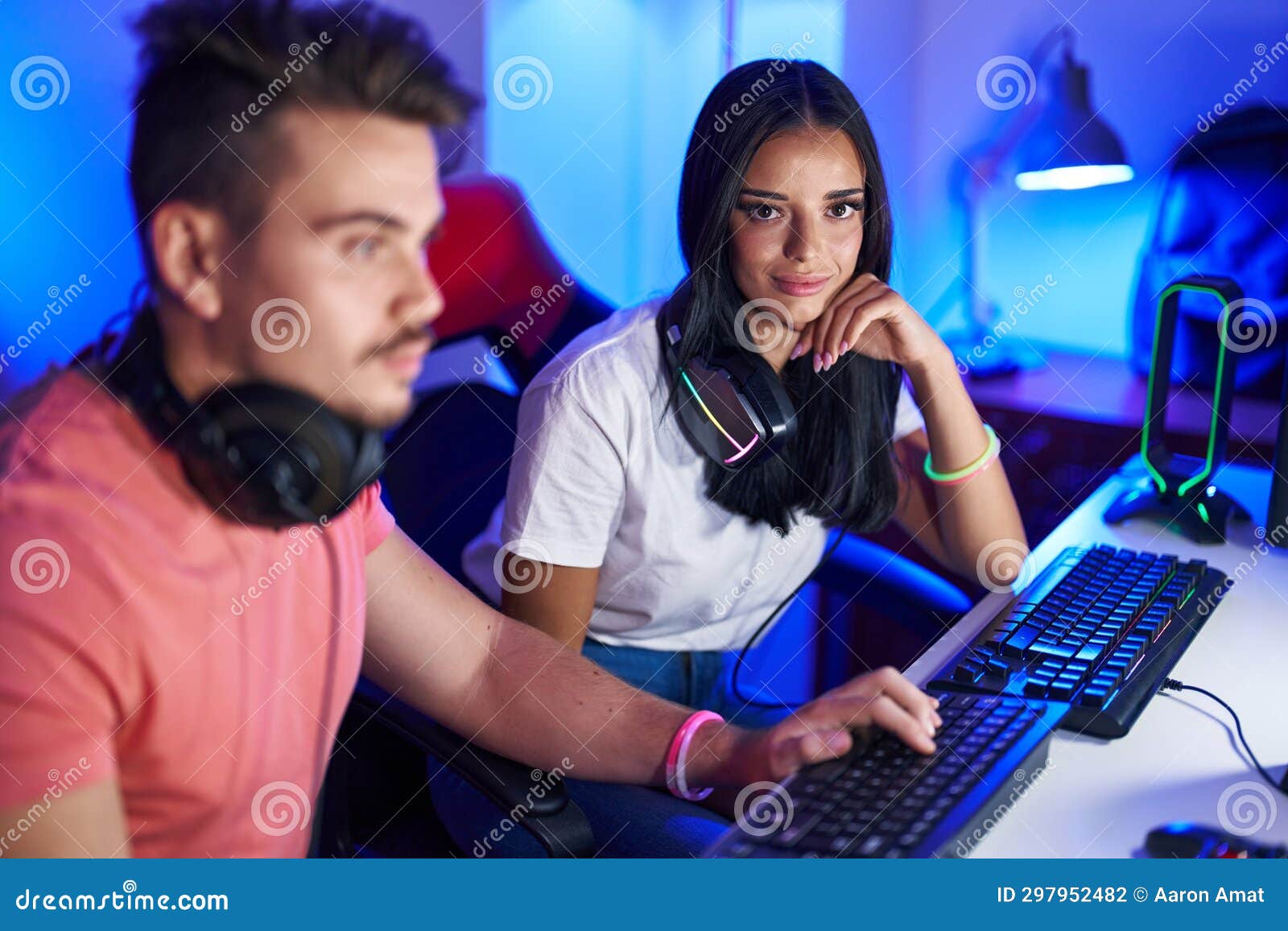 Man and Woman Streamers Playing Video Game Using Computer at Gaming ...