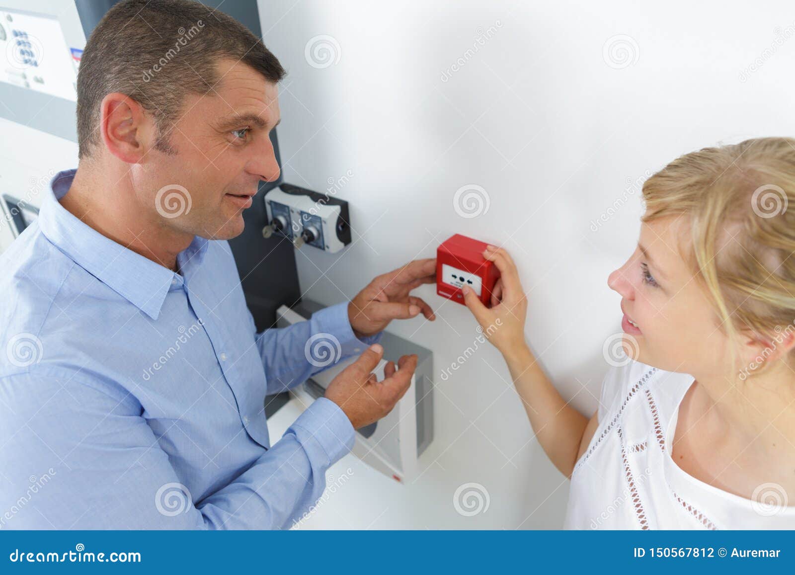 Man and Woman Talking about Fire Alarm Stock Photo - Image of person ...