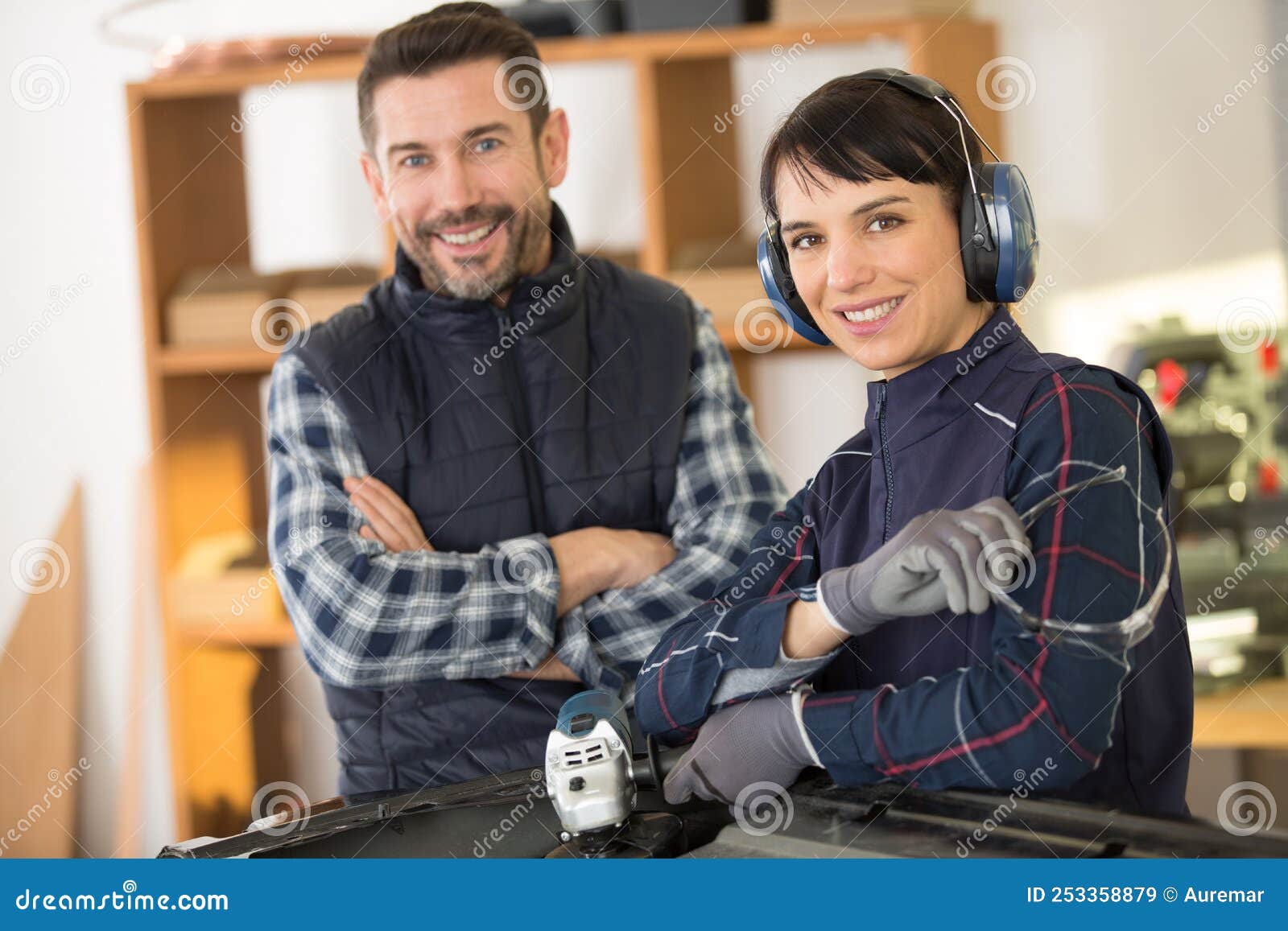 Man with Woman Using Angle Grinder on Car Bodywork Stock Image - Image ...