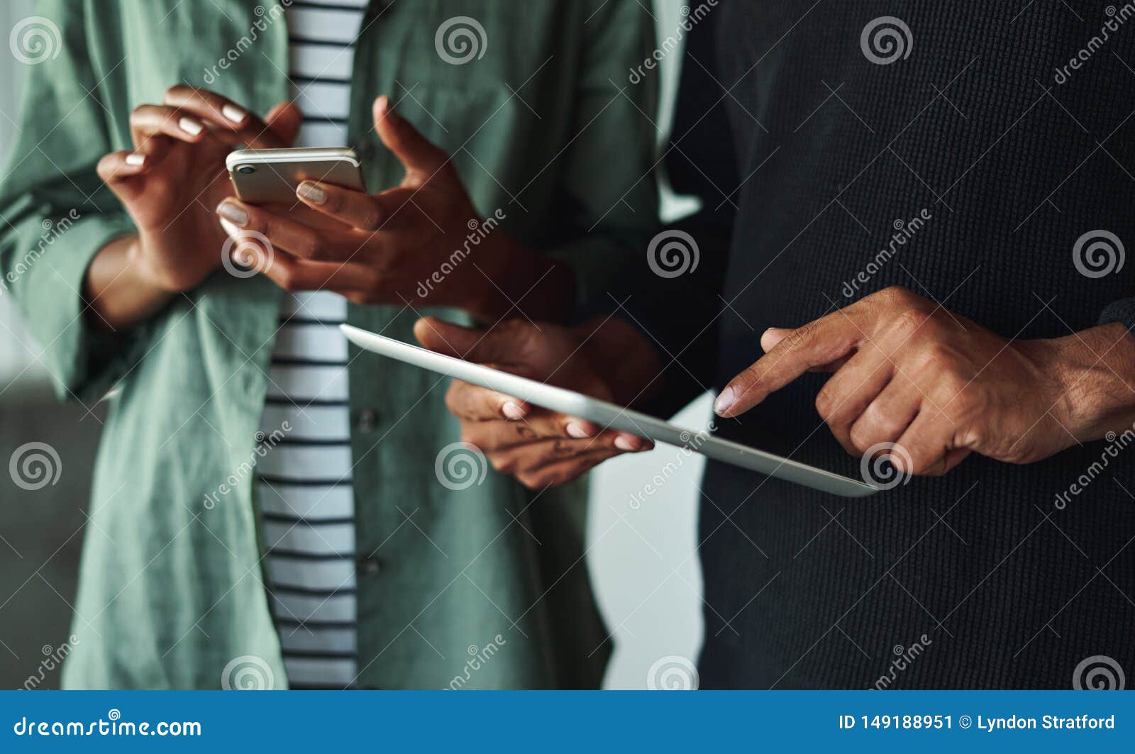 Man and Woman Using Digital Tablet and Smartphone Stock Image - Image ...
