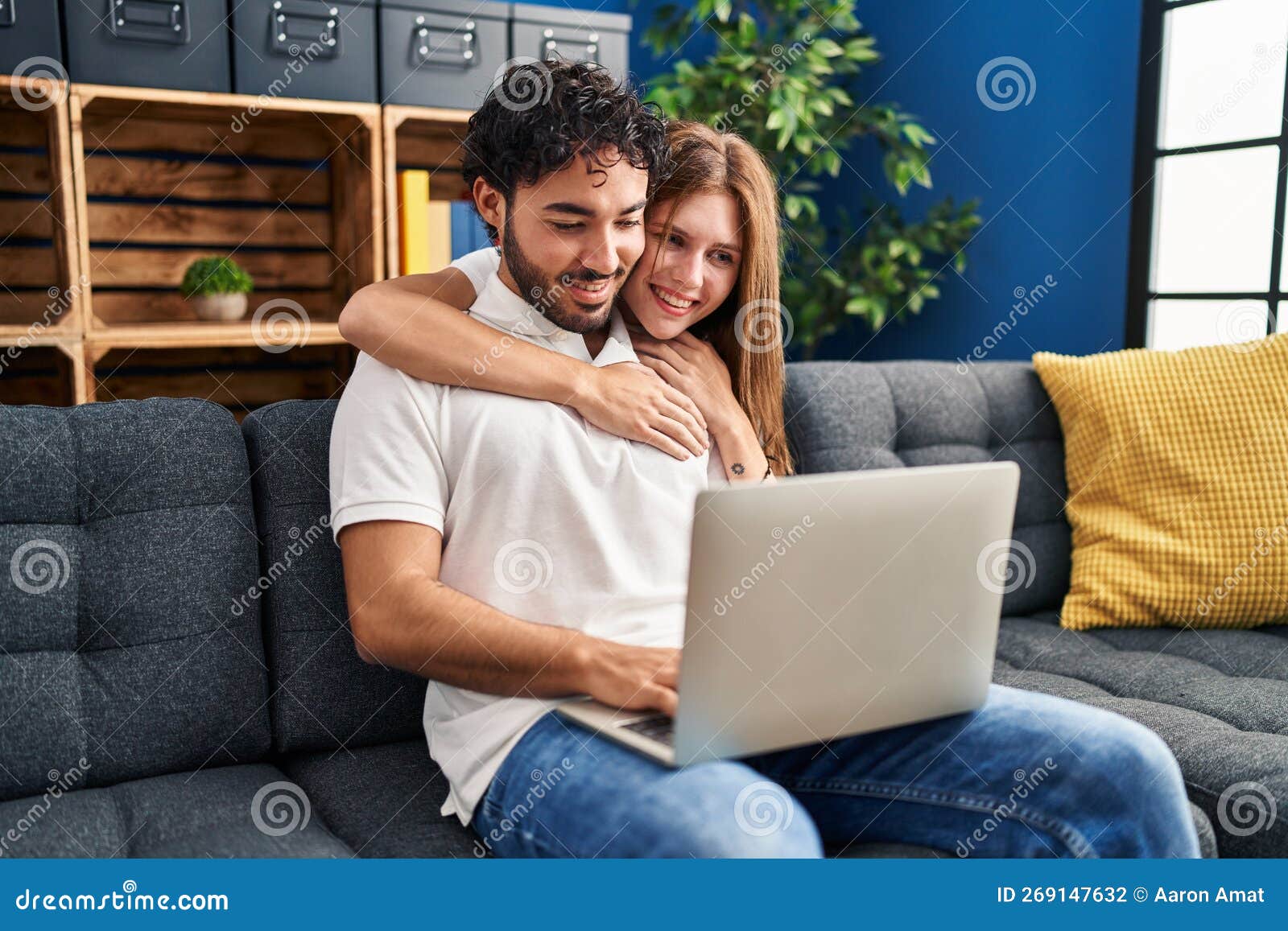 Man and Woman Using Laptop Hugging Each Other at Home Stock Photo ...