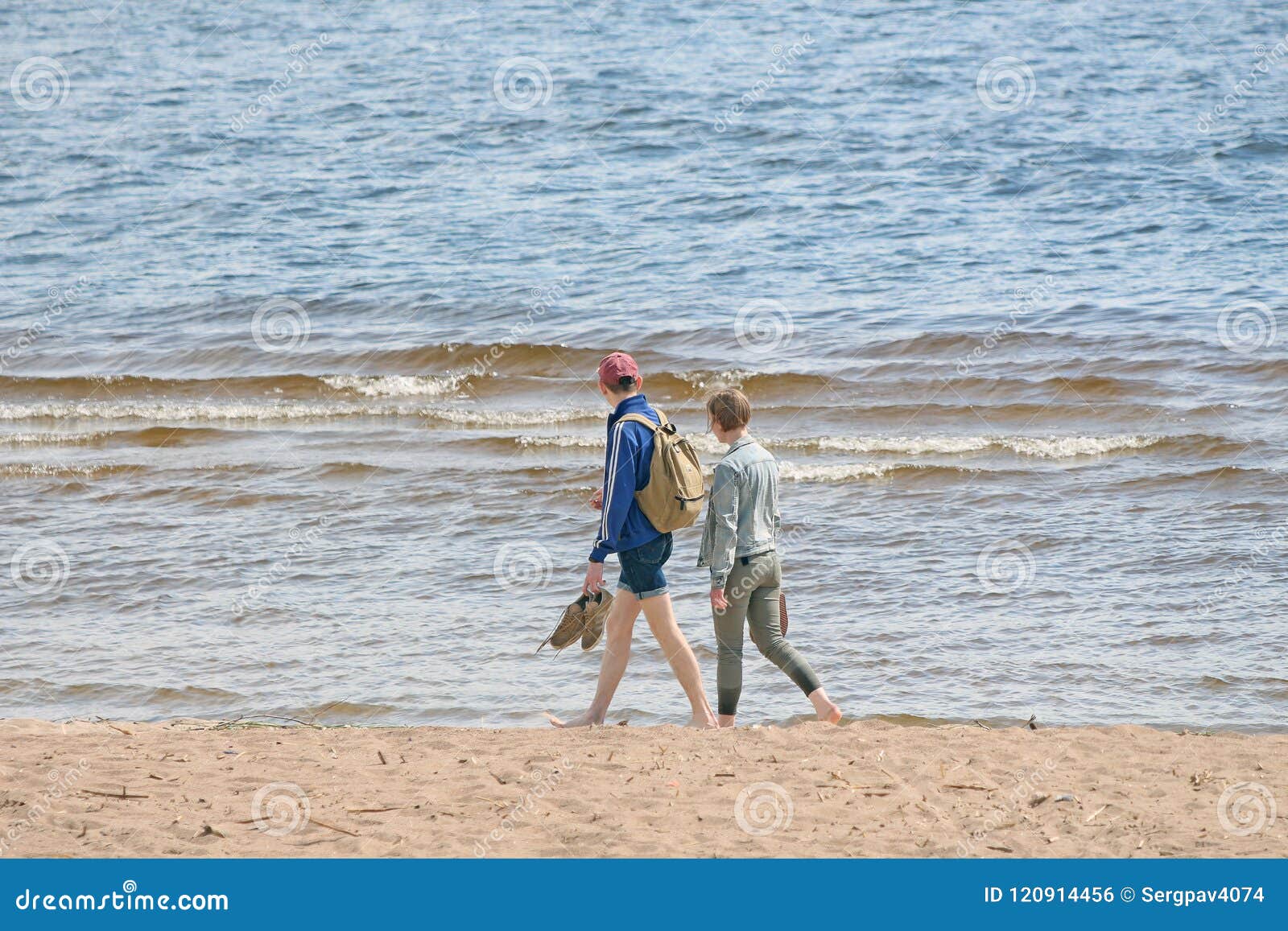 Man and Woman Walking Along the Seashore Editorial Photo - Image of ...