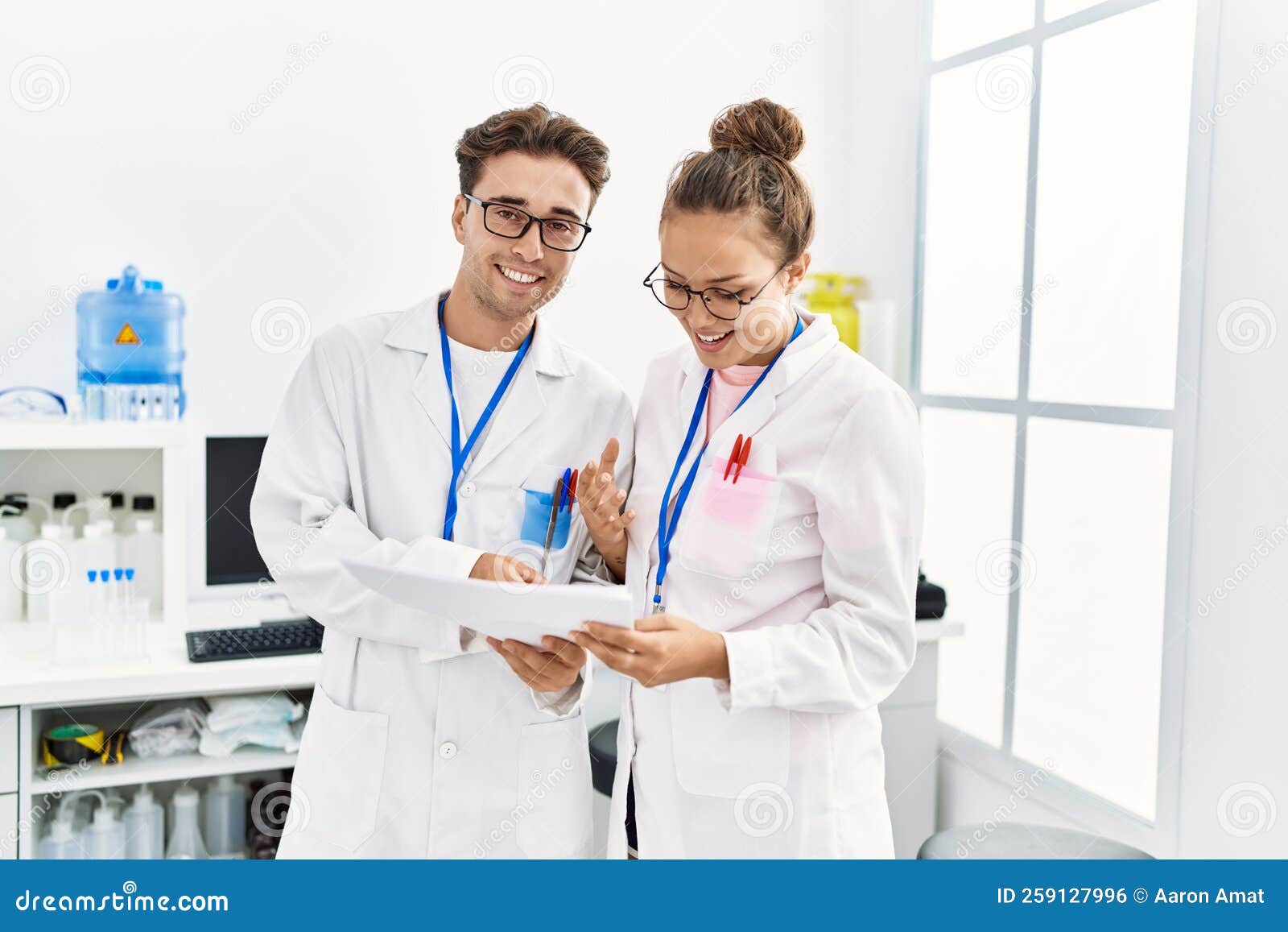 Man and Woman Wearing Scientist Uniform Working at Laboratory Stock ...