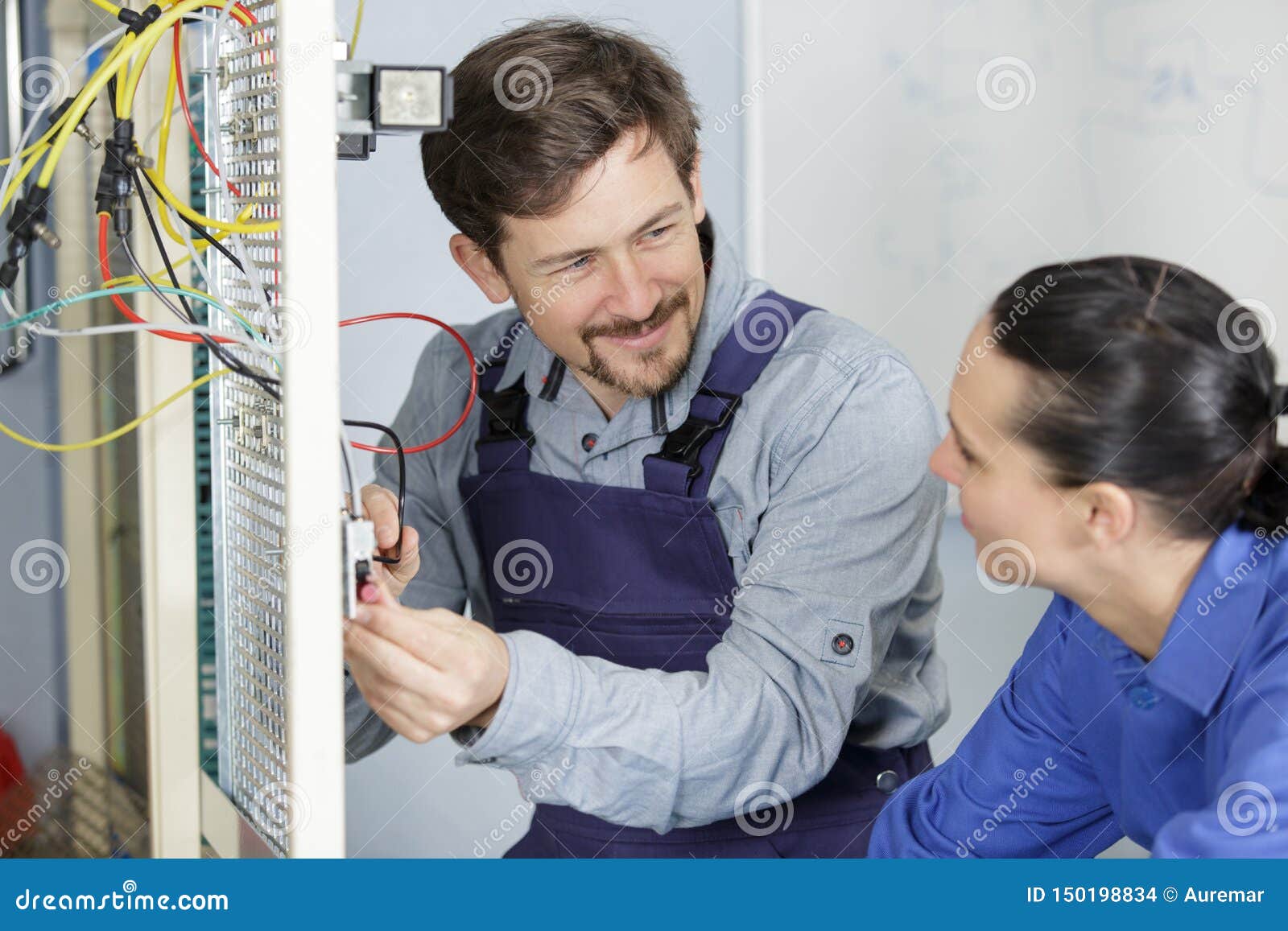 Man and Woman Working on Electronic Factory Stock Photo - Image of ...