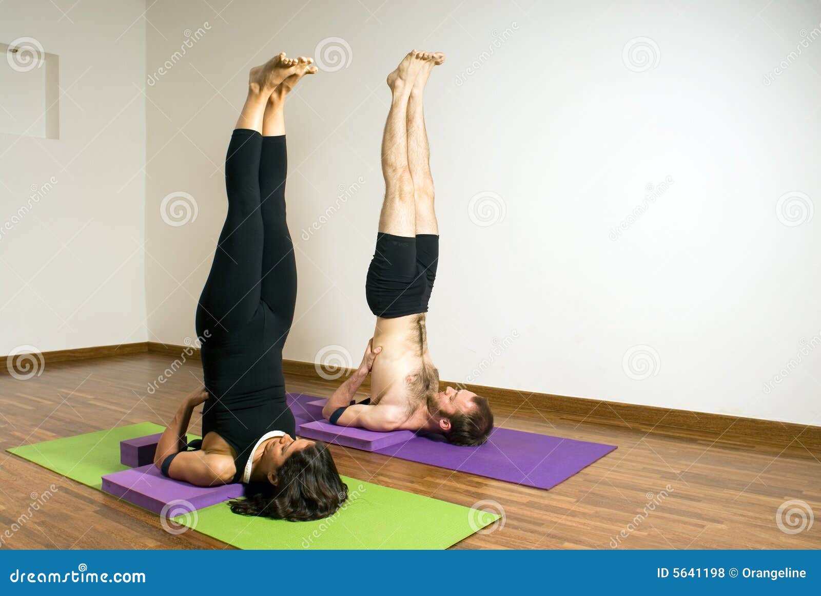 Man and Woman in a Yoga Stretch - Vertical Stock Photo - Image of ...