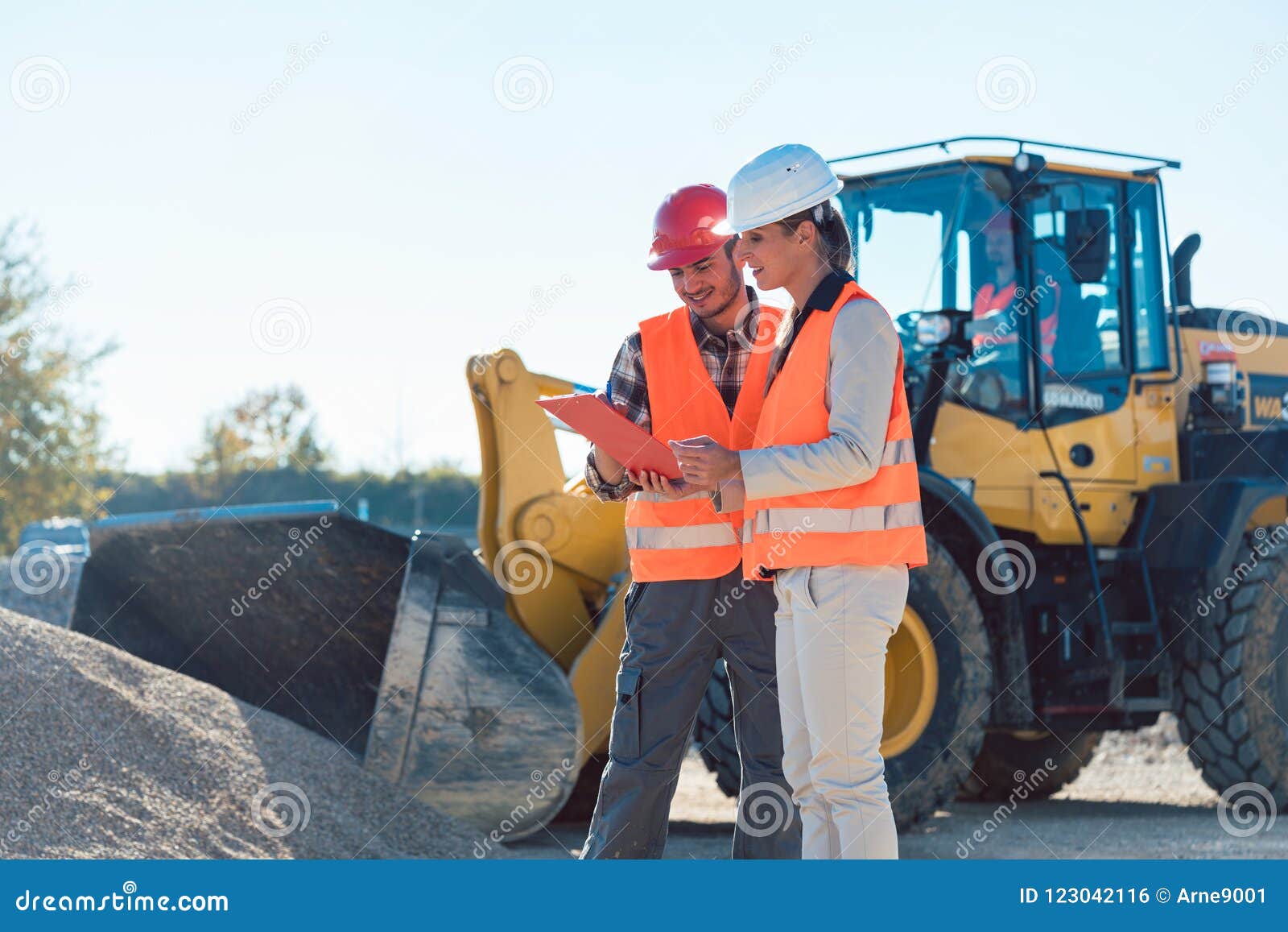 Man and Woman Worker on Construction Site Stock Photo - Image of ...