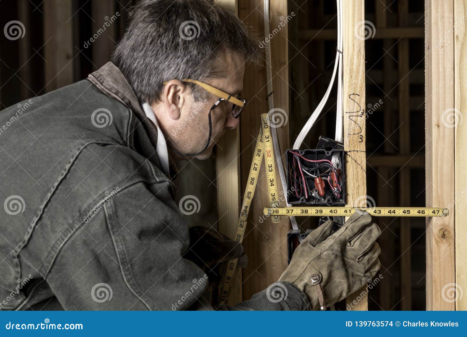 Master Electrician Measures for Box Locations Stock Photo - Image of ...
