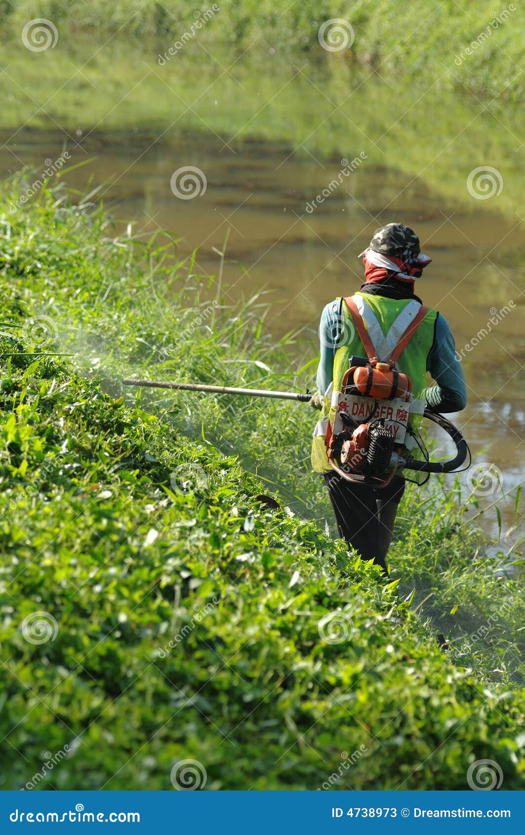 Man at work cutting grass stock image. Image of grass - 4738973
