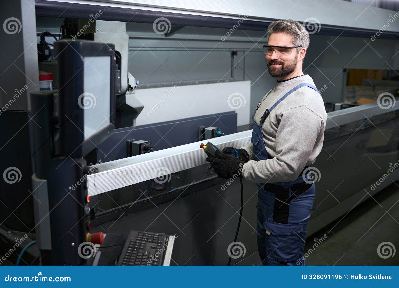 Man in Work Equipment at a Workplace in Production Workshop Stock Photo ...
