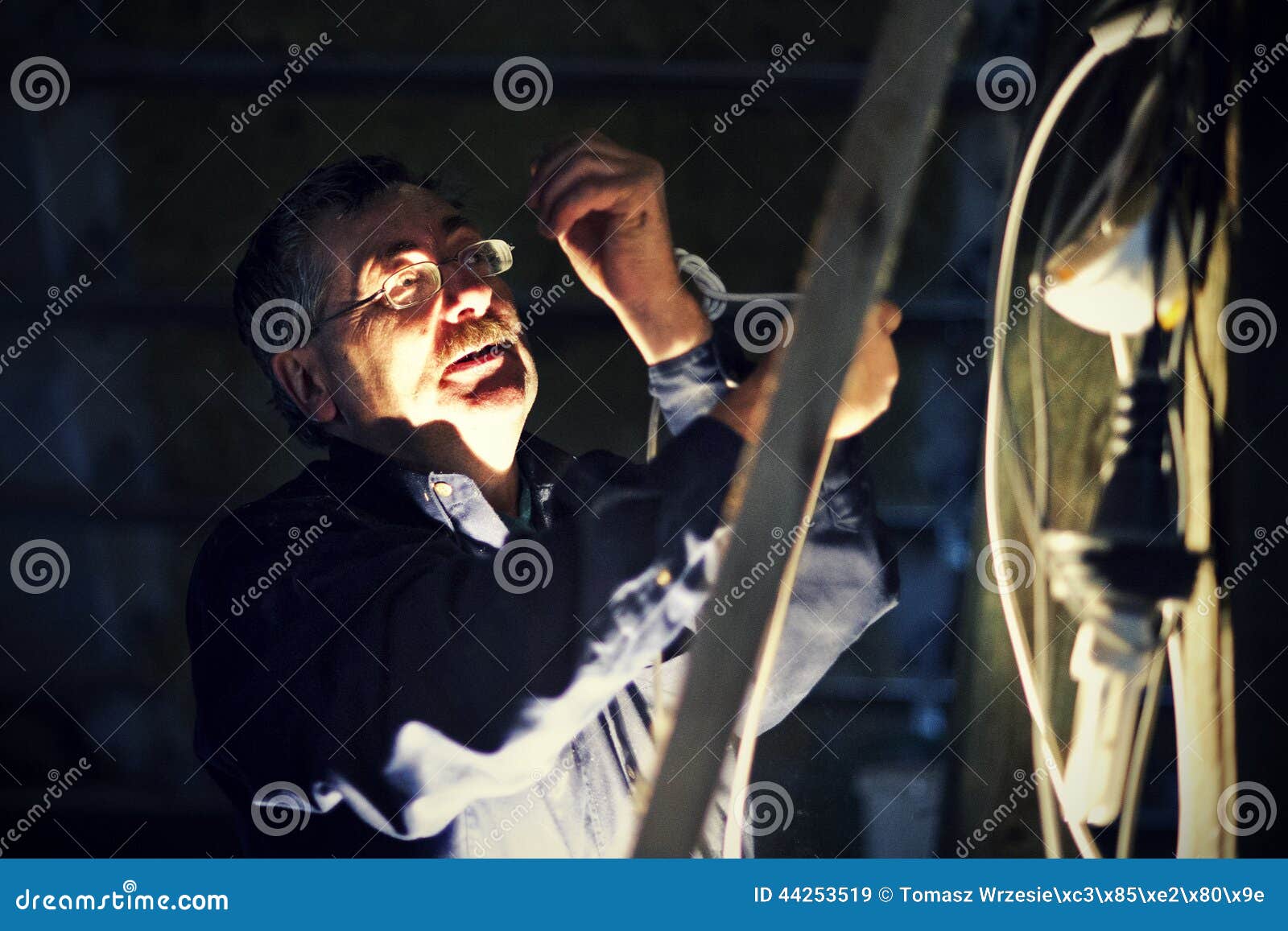 Man at work stock image. Image of light, build, attic - 44253519