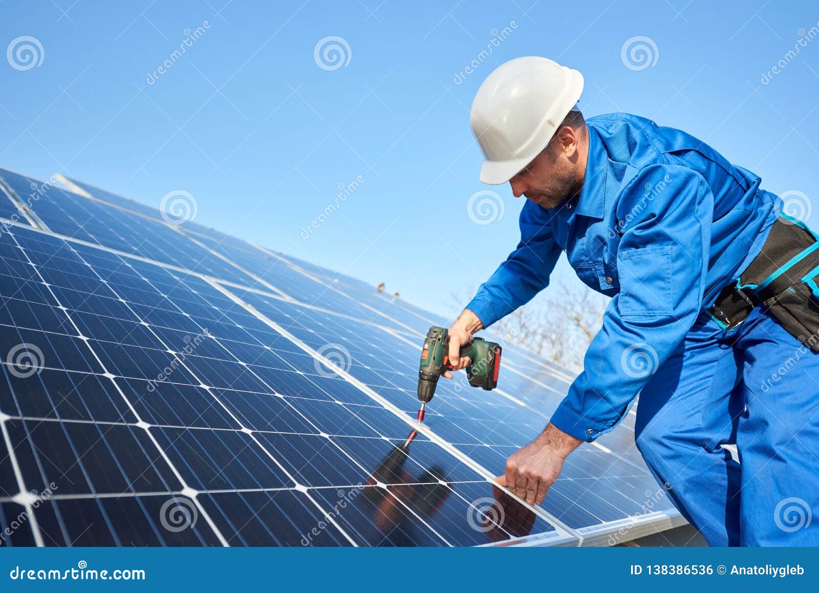 Electrician Mounting Solar Panel on Roof of Modern House Stock Photo ...