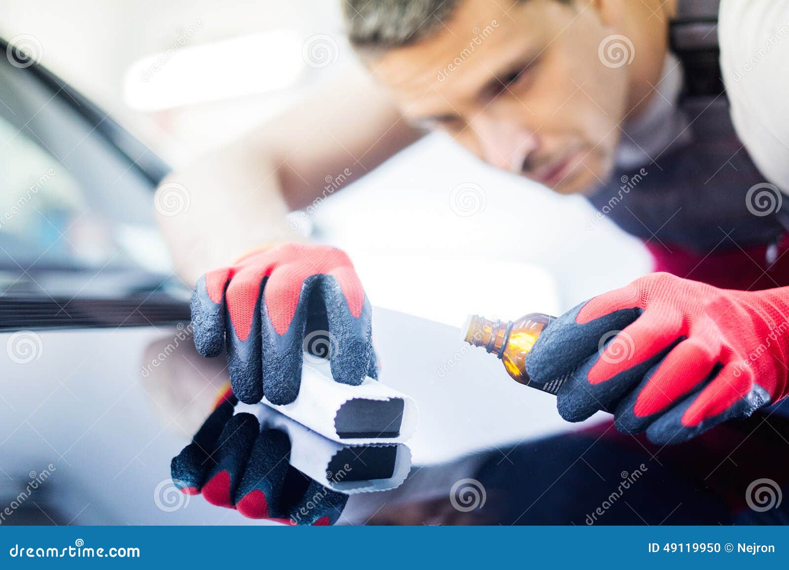 Man worker on a car wash stock photo. Image of windshield - 49119950