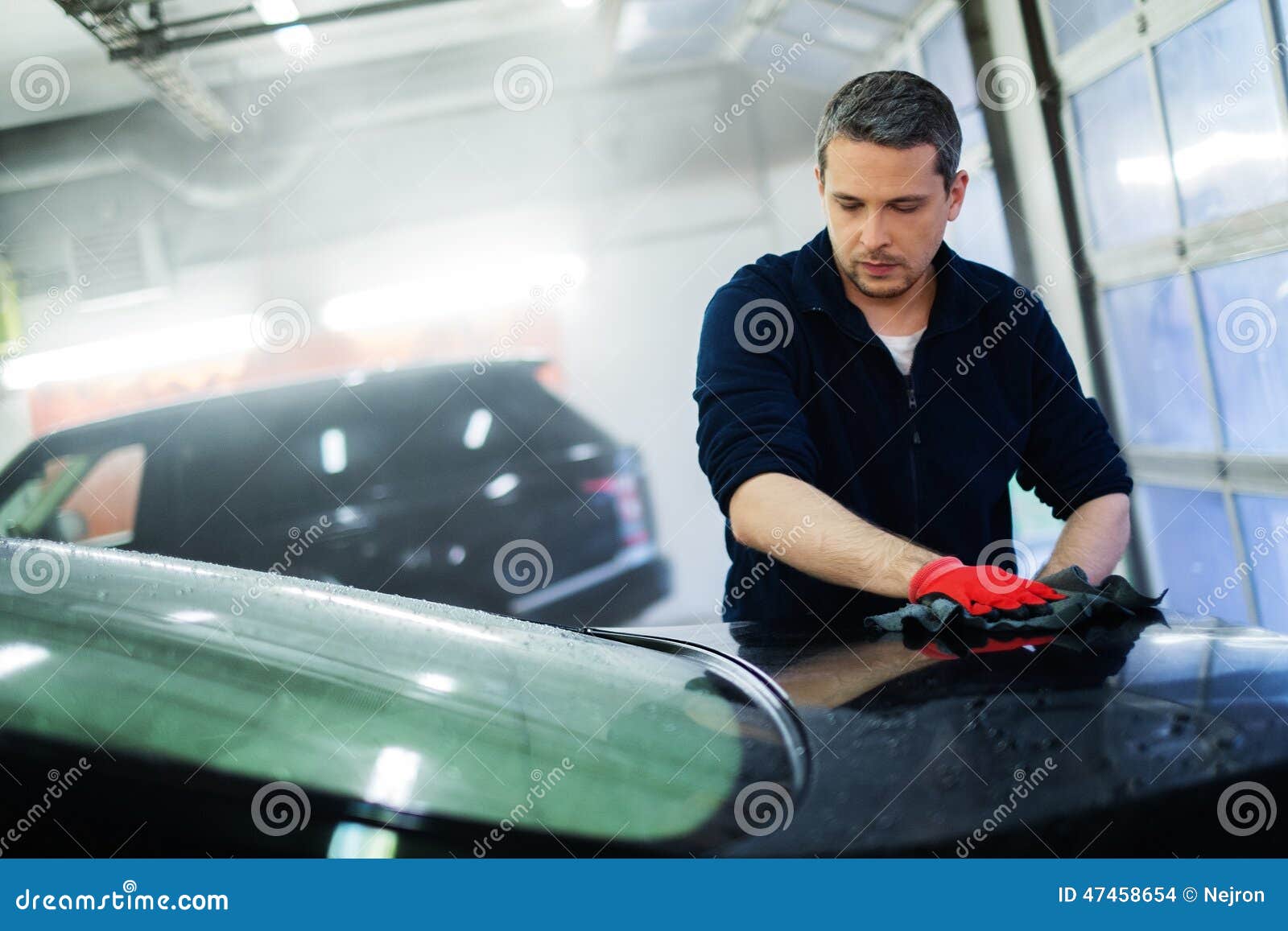 Man worker on a car wash stock photo. Image of care, equipment - 47458654