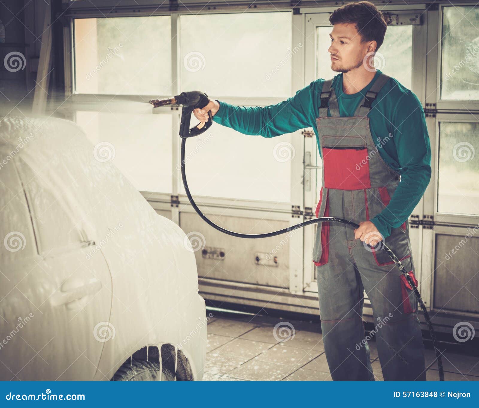 Man worker on a car wash stock photo. Image of exterior - 57163848