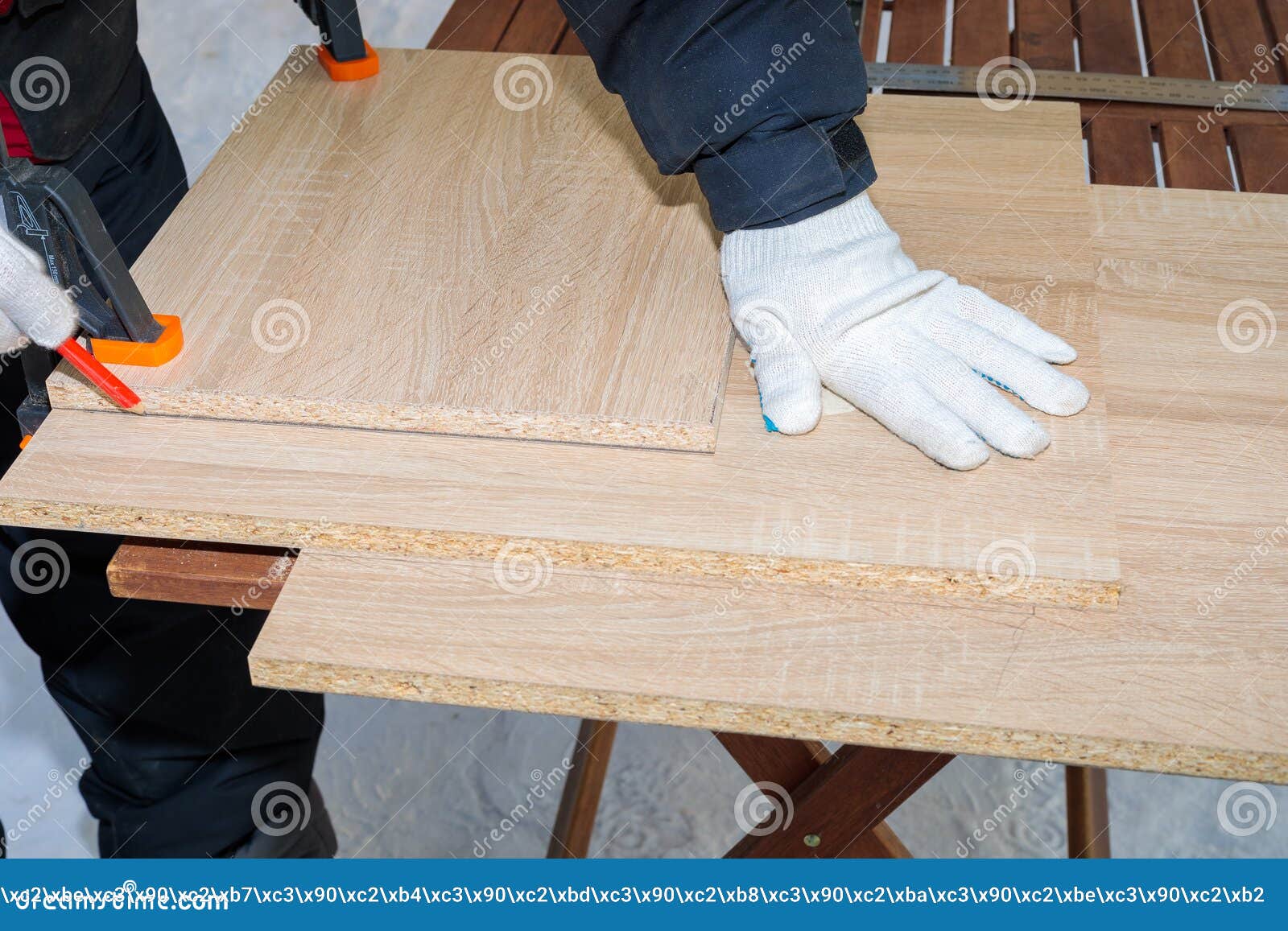 A Man, a Worker Draws with a Pencil on a Chipboard Board. Stock Photo ...
