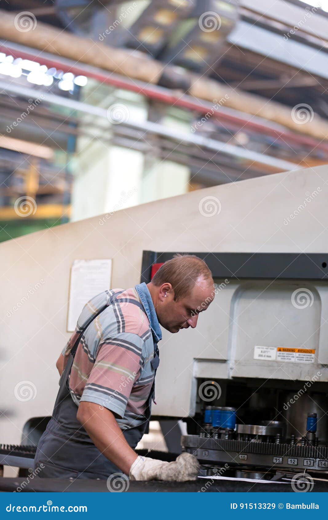 Man Worker at Factory Workshop Adjusting Equipment Stock Image - Image ...