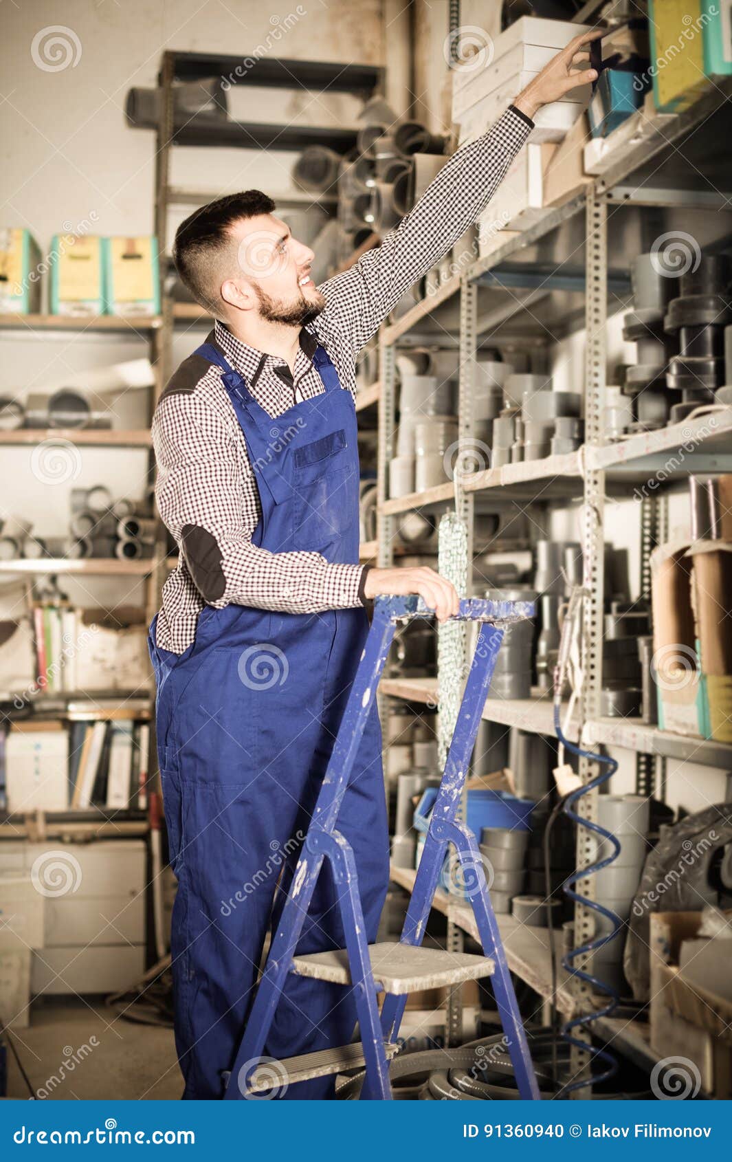 Man Worker Going through Sanitary Engineering Details in Workshop Stock ...