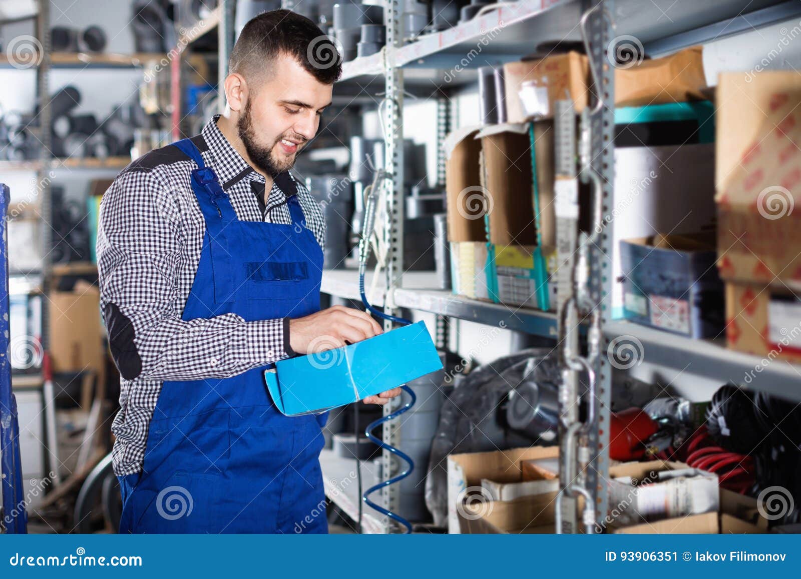 Man Worker Going through Sanitary Engineering Details in Workshop Stock ...
