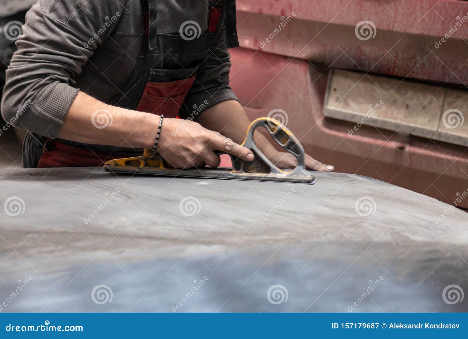 Man Worker Preparing for Painting a Car Element Using Emery Sender by a ...