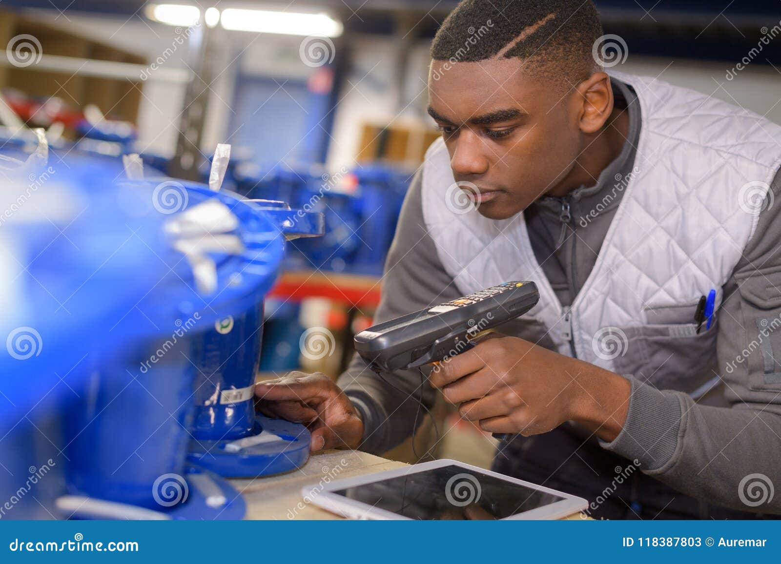 Man Worker Scanning Packages with Barcode Scanner in Warehouse Stock ...