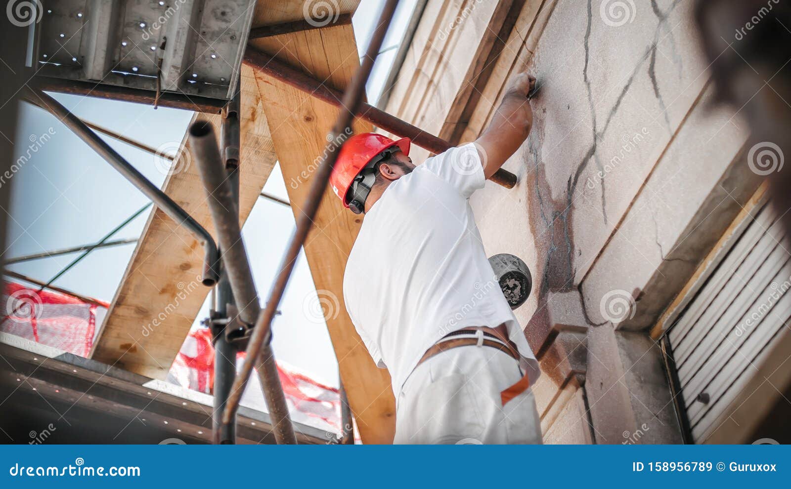 Man Worker Standing on Scaffolding and Restore Old Building Facade ...