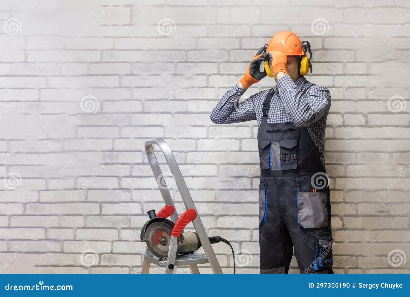 Man Worker in Uniform is Putting His Hard Hat. Stock Photo - Image of ...