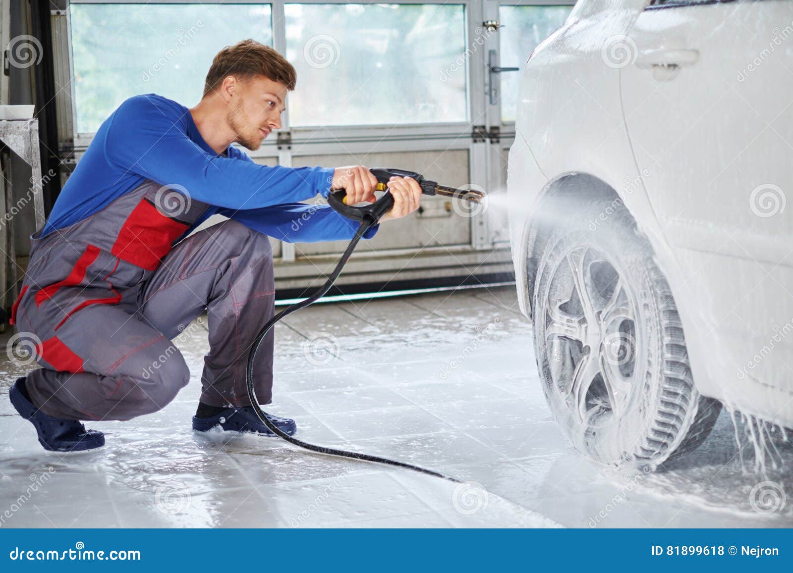Man Worker Washing Luxury Car on a Car Wash Stock Photo - Image of ...