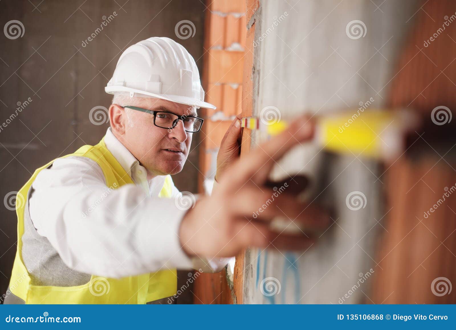 Man Working As Architect Measuring Wall in Construction Site Stock ...