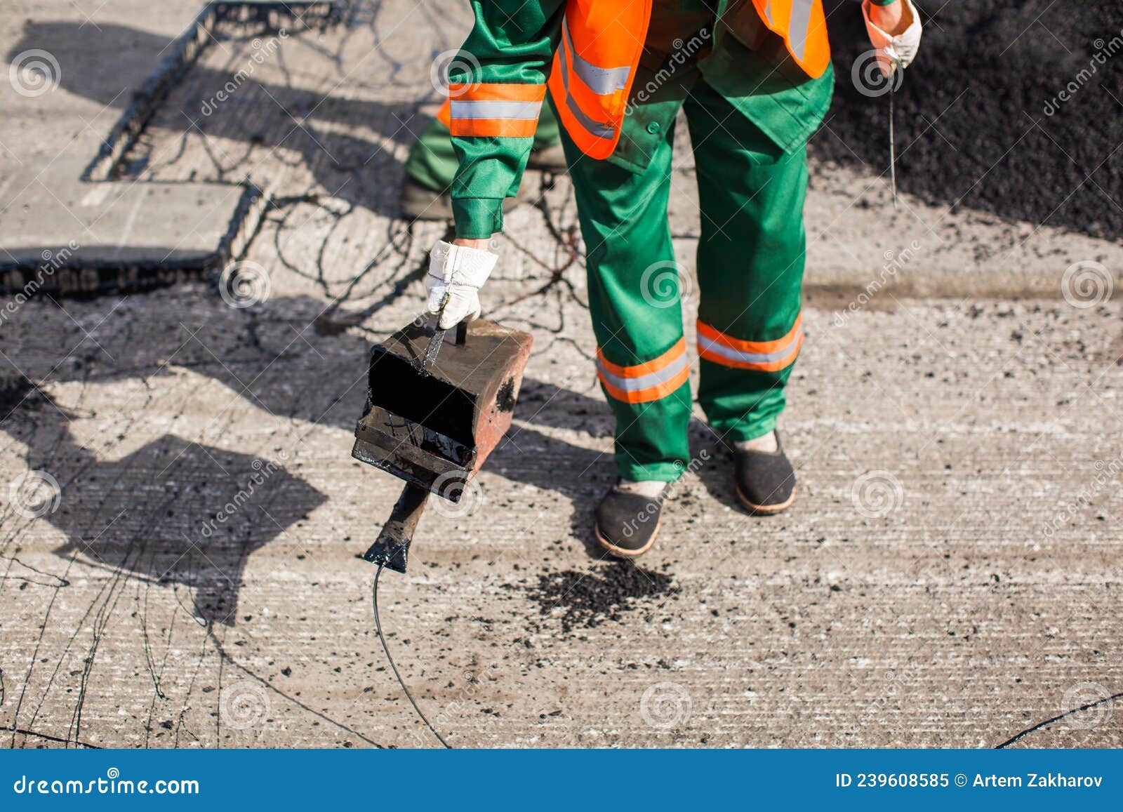 The Man Working Asphalt Pouring Tar for Road Repair. Stock Image ...