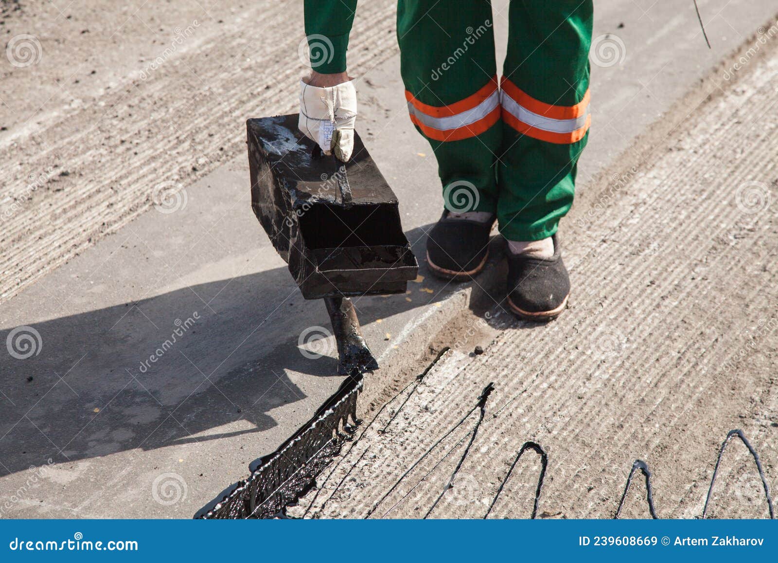 The Man Working Asphalt Pouring Tar For Road Repair. Stock Image ...