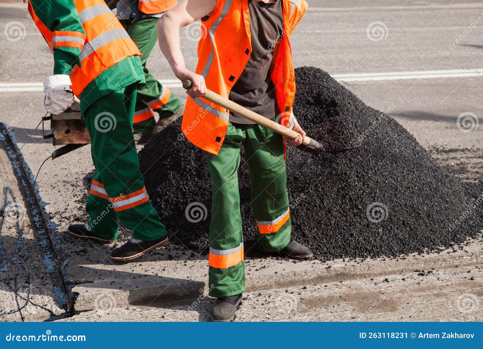 The Man Working Asphalt Pouring Tar for Road Repair. Stock Image ...