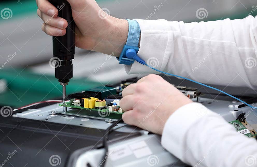 Man Working on Assembly Line Stock Image - Image of line, screwdriver ...