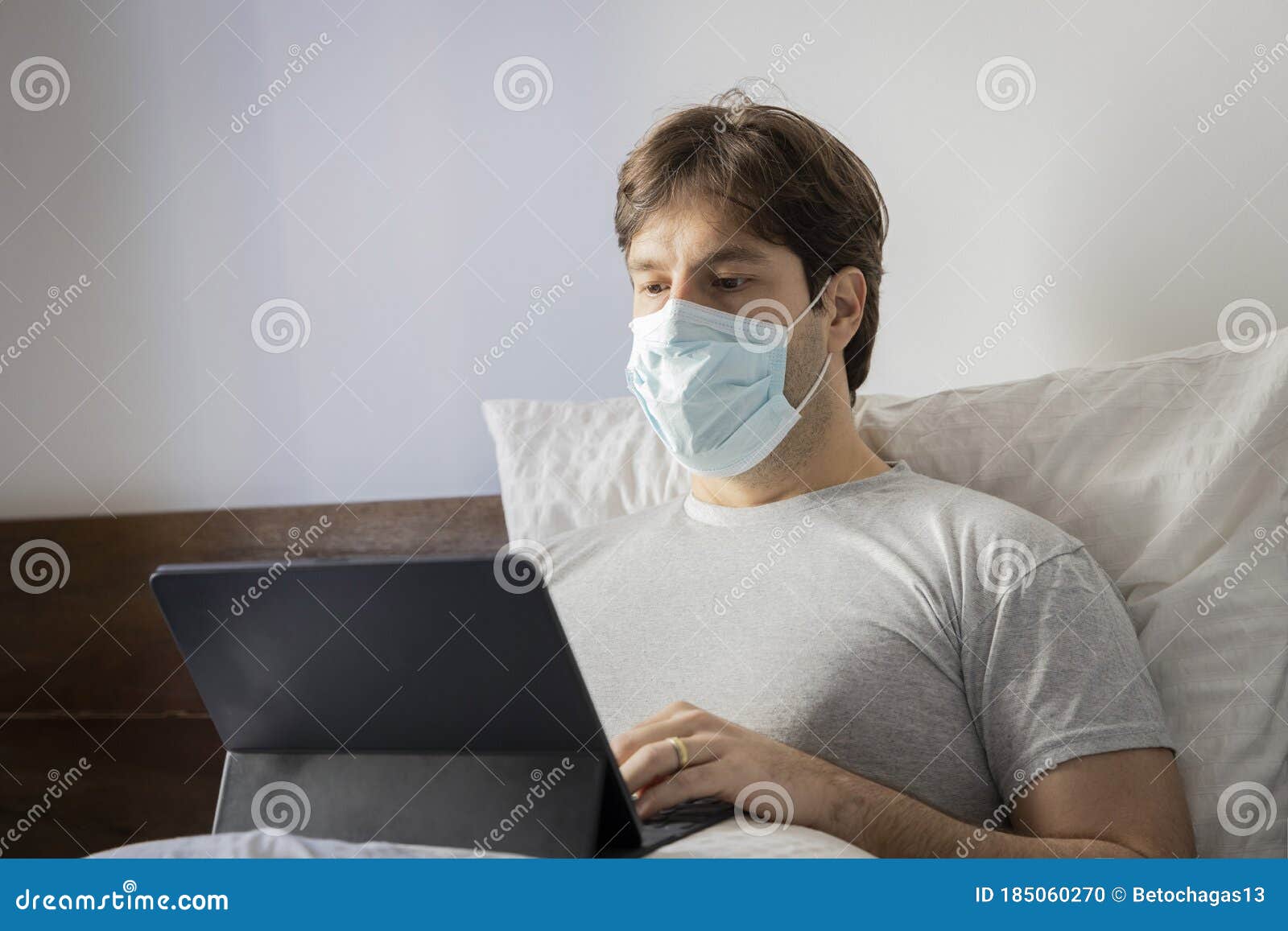 Man Working in Bed, Doing Home Office because he is Sick Stock Photo ...