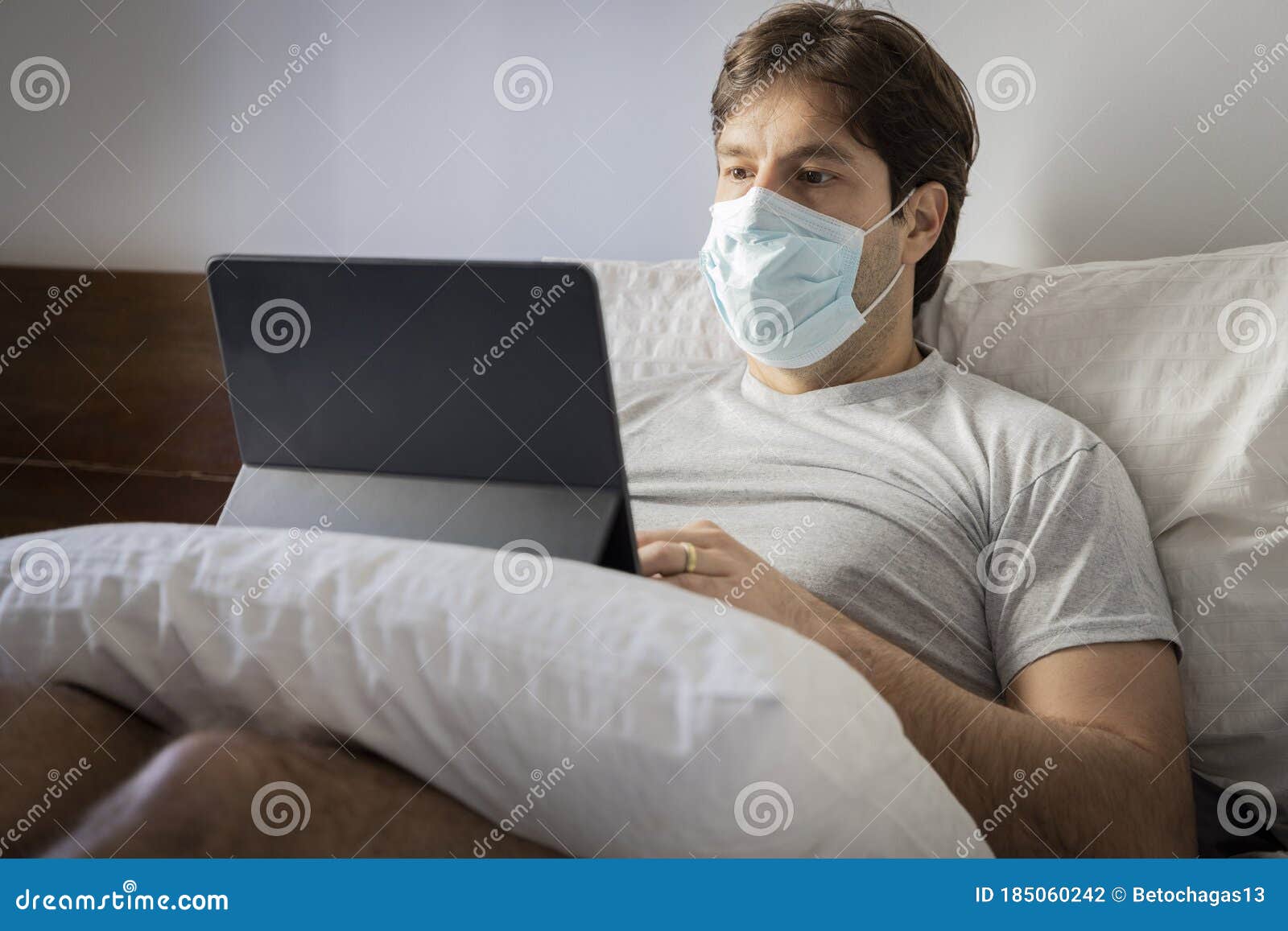 Man Working in Bed, Doing Home Office because he is Sick Stock Photo ...