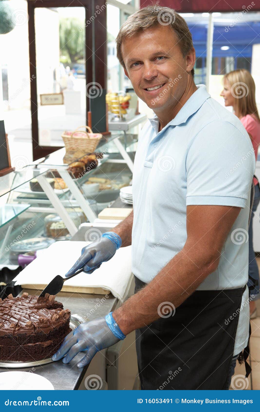 Man Working Behind Counter in Cafe Slicing Cake Stock Image - Image of ...
