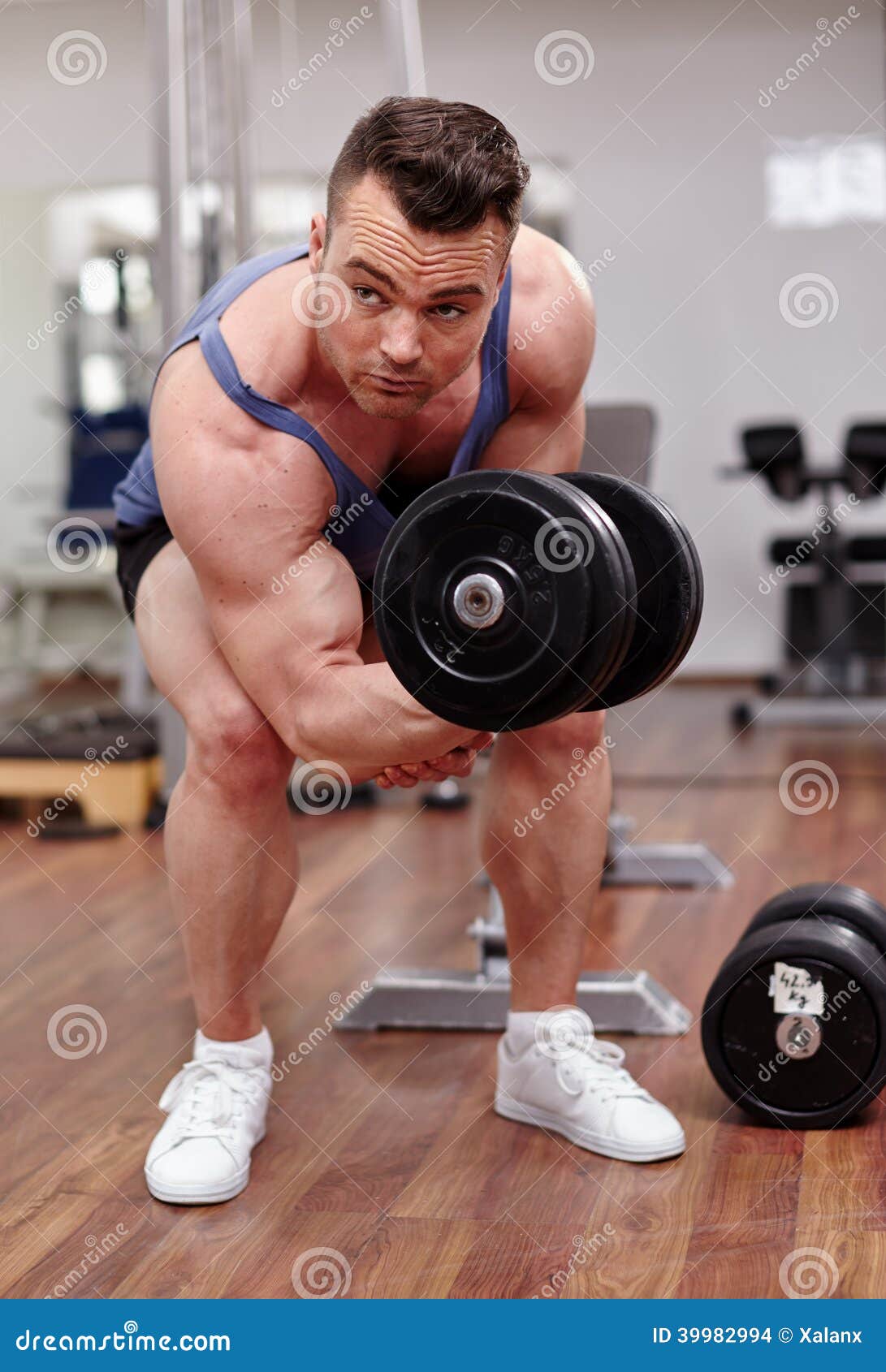 Man working biceps stock photo. Image of dumbbell, gymnastics - 39982994