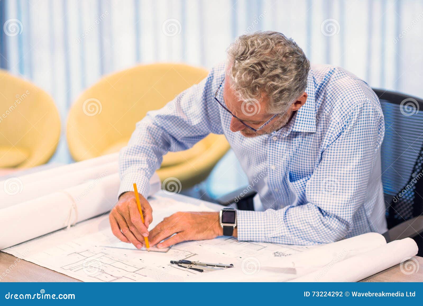Man working on blueprint stock photo. Image of profession - 73224292