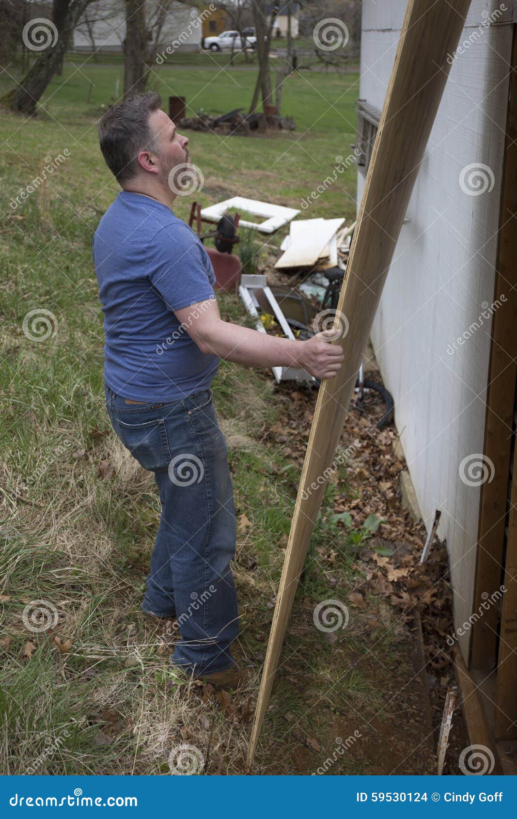 Man working with a board stock photo. Image of builder - 59530124