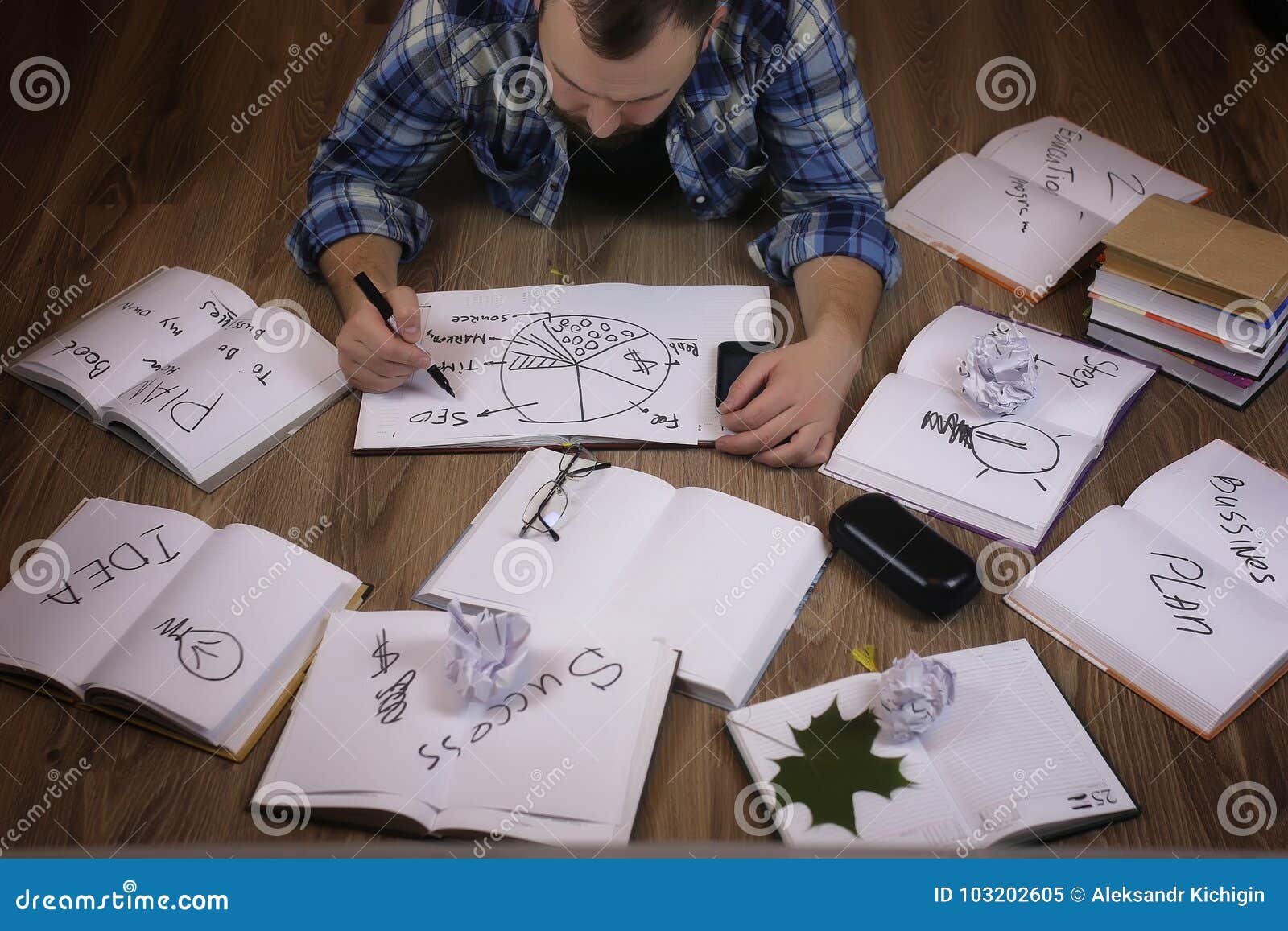 Man Working with Book on the Floor Stock Image - Image of idea, college ...