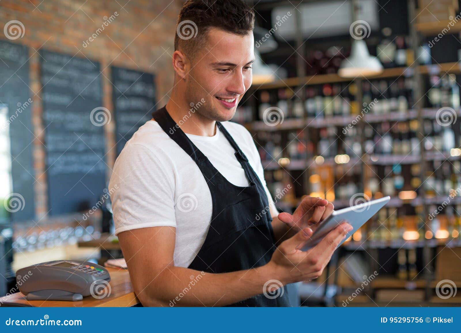 Man working at cafe stock photo. Image of friendly, seller - 95295756