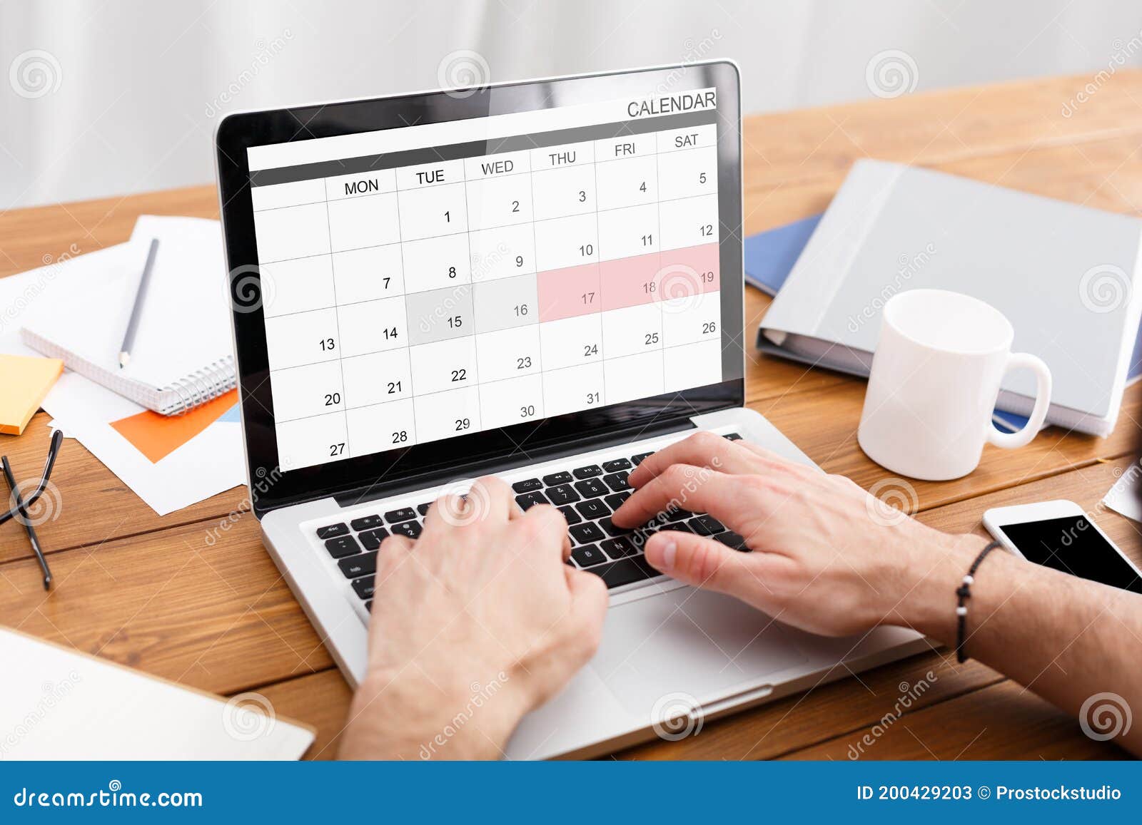 Man Working with Calender Planner on Laptop in Office, Managing ...