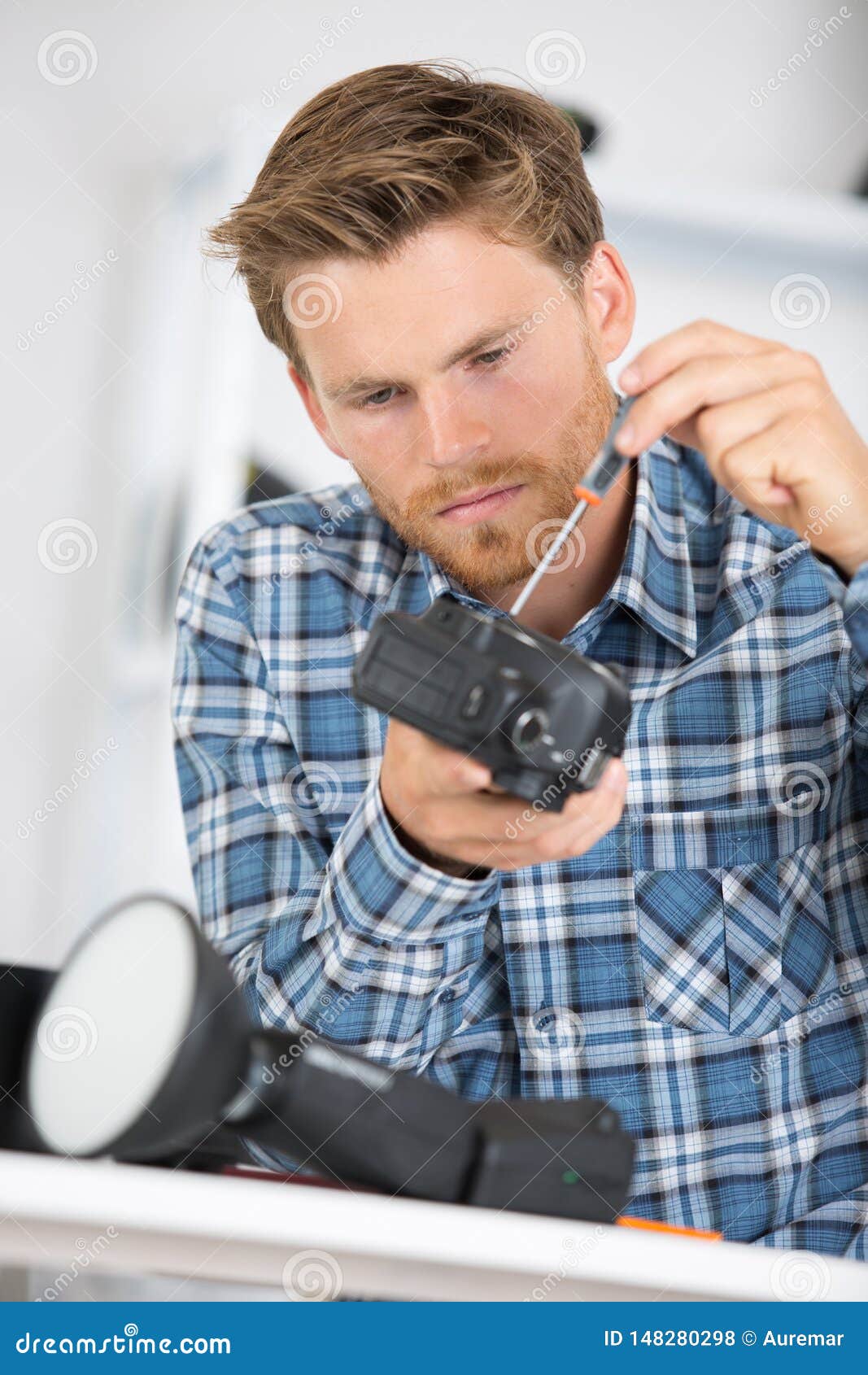 Man working on camera stock photo. Image of expertise - 148280298
