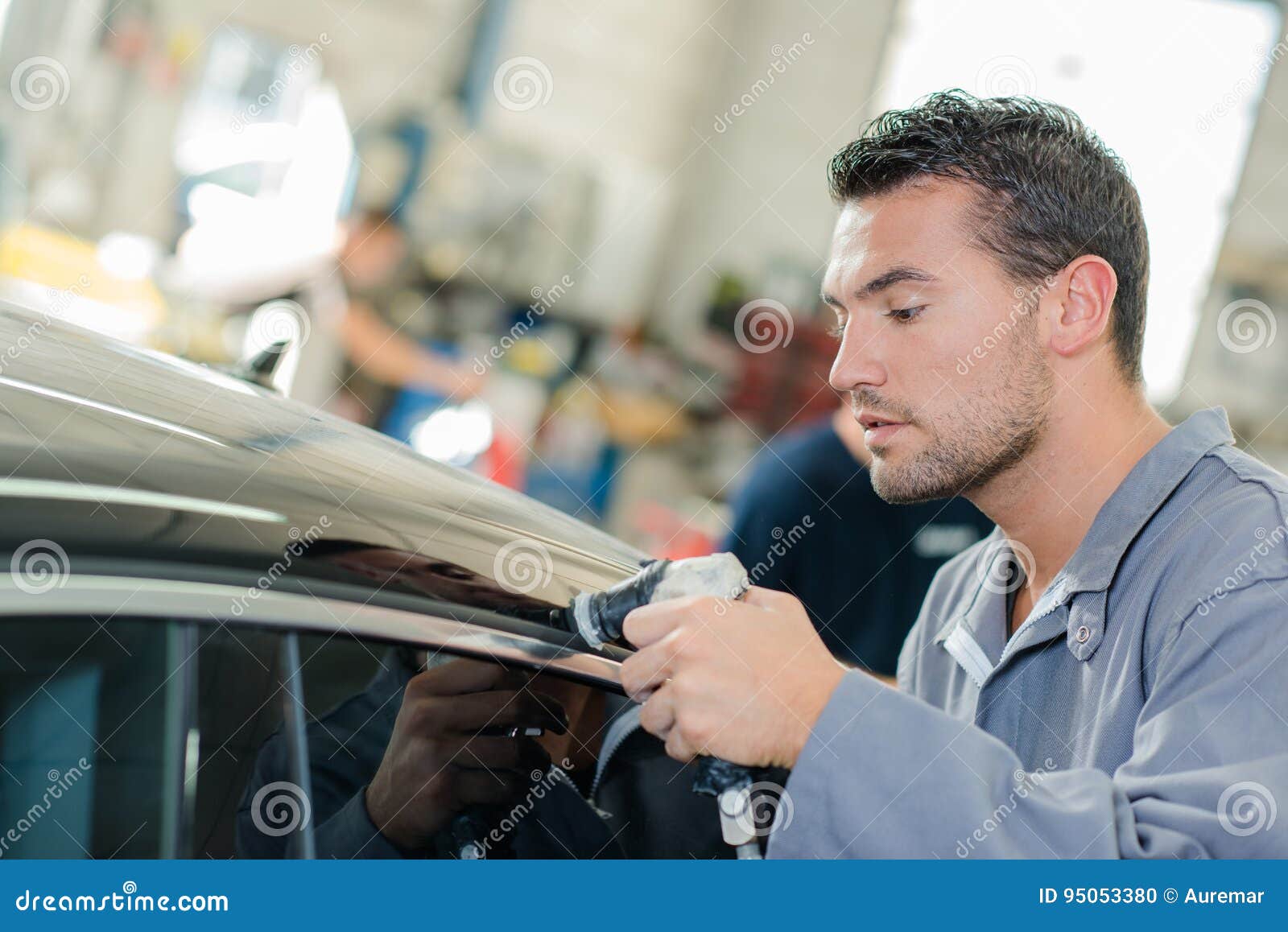Man working on car body stock photo. Image of sealing - 95053380