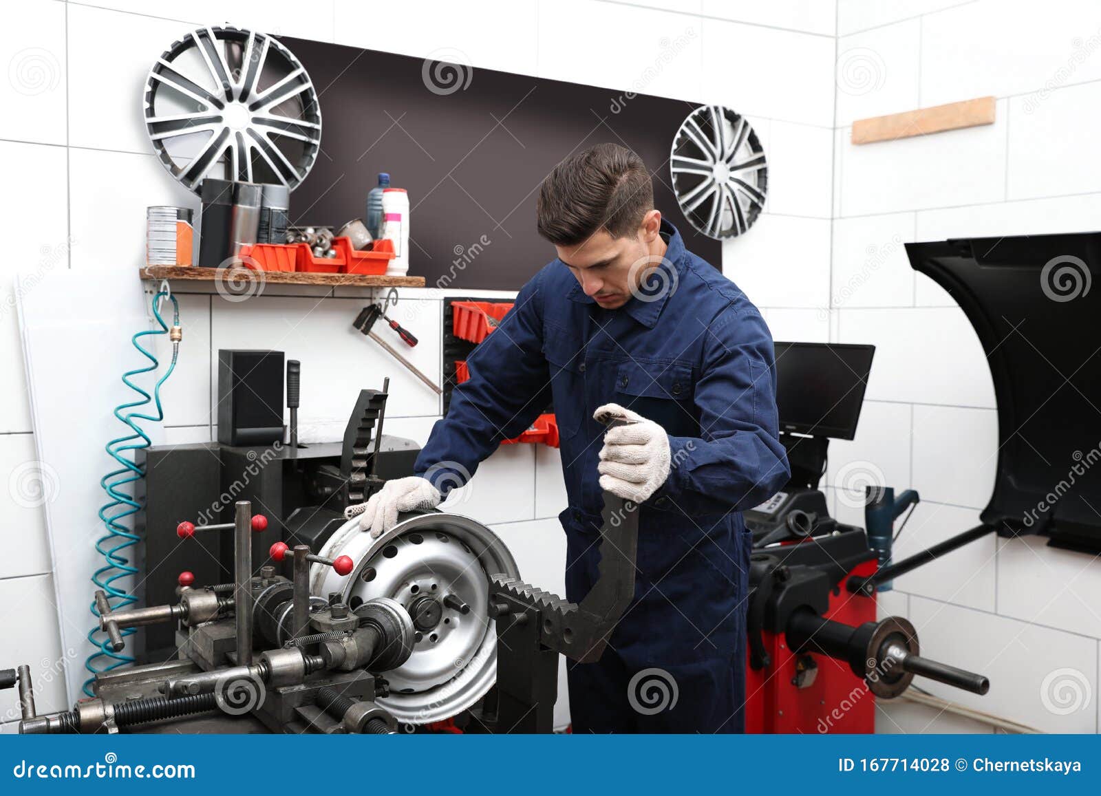 Man Working with Car Disk Lathe Machine at Service Stock Photo - Image ...