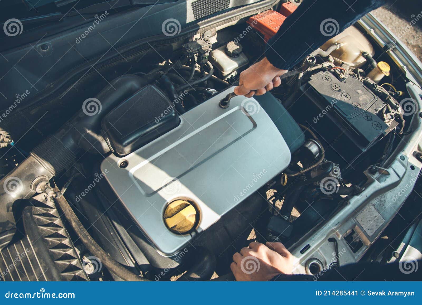 Man working in car motor. stock image. Image of wrench - 214285441